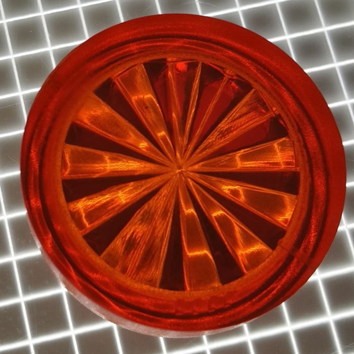 I_075_R_T_S_AM 3/4" Round Transparent Starburst Amber Playfield Insert